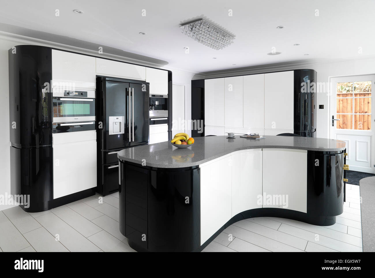 White kitchen units with black worktop hi-res stock photography and ...