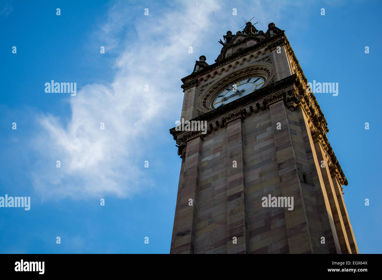 Albert Memorial Clock tower in Belfast in Northern Ireland with blie ...