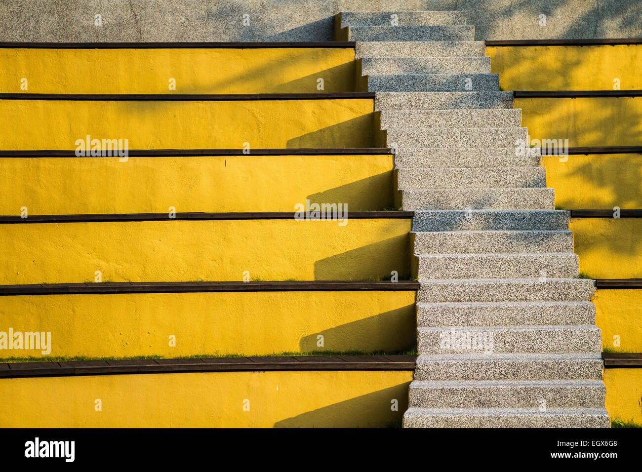 Steps going down yellow rows Stock Photo - Alamy