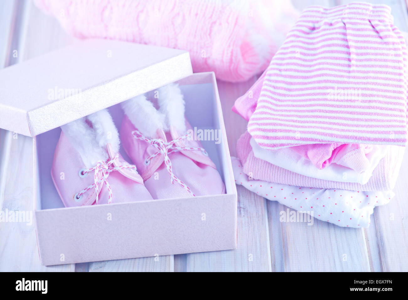 baby clothes for baby girl on a table Stock Photo - Alamy