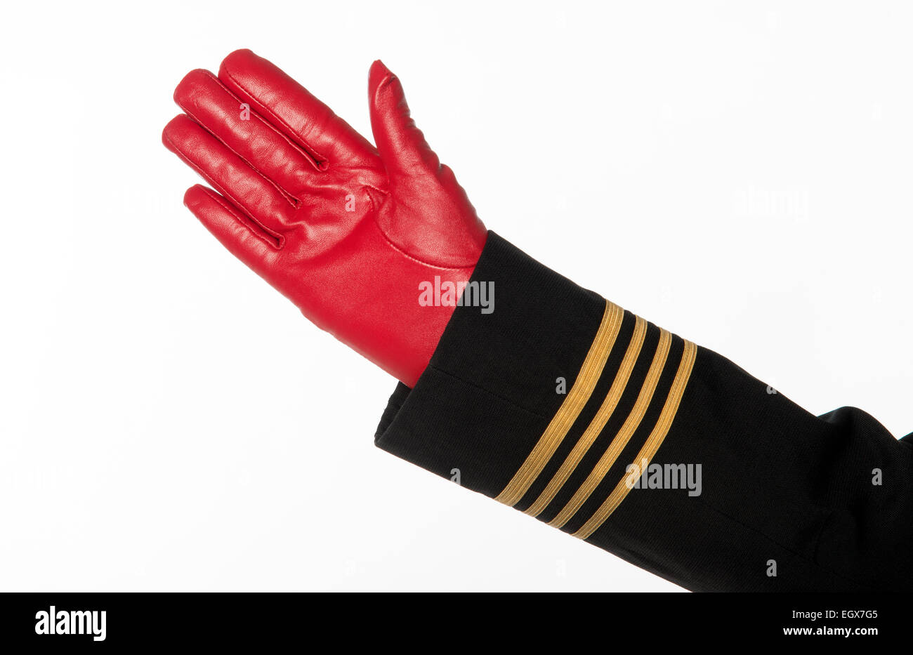 Four gold rings on airline officers uniform Hand waving gold braid ...