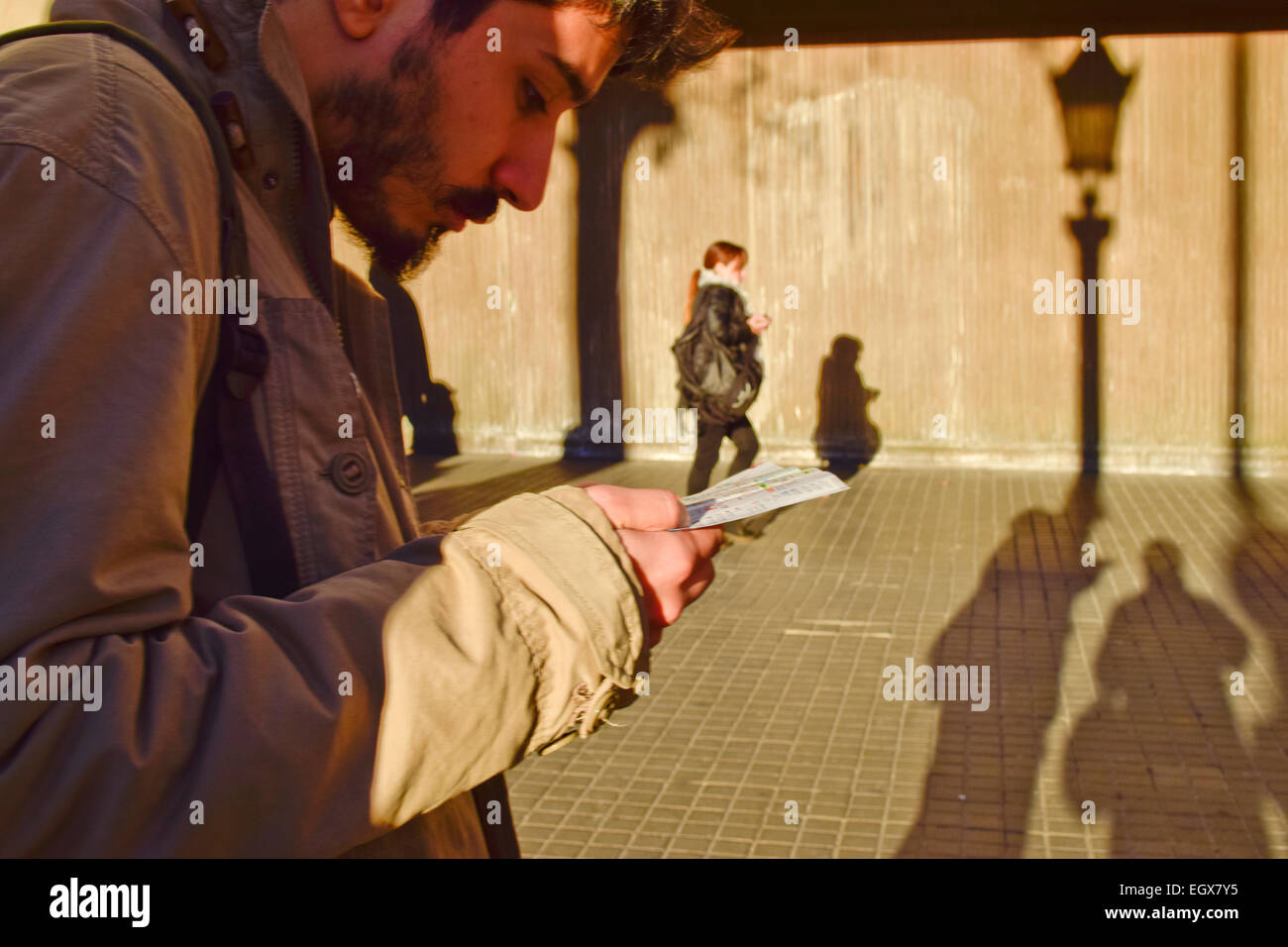 Man reading paper Stock Photo - Alamy