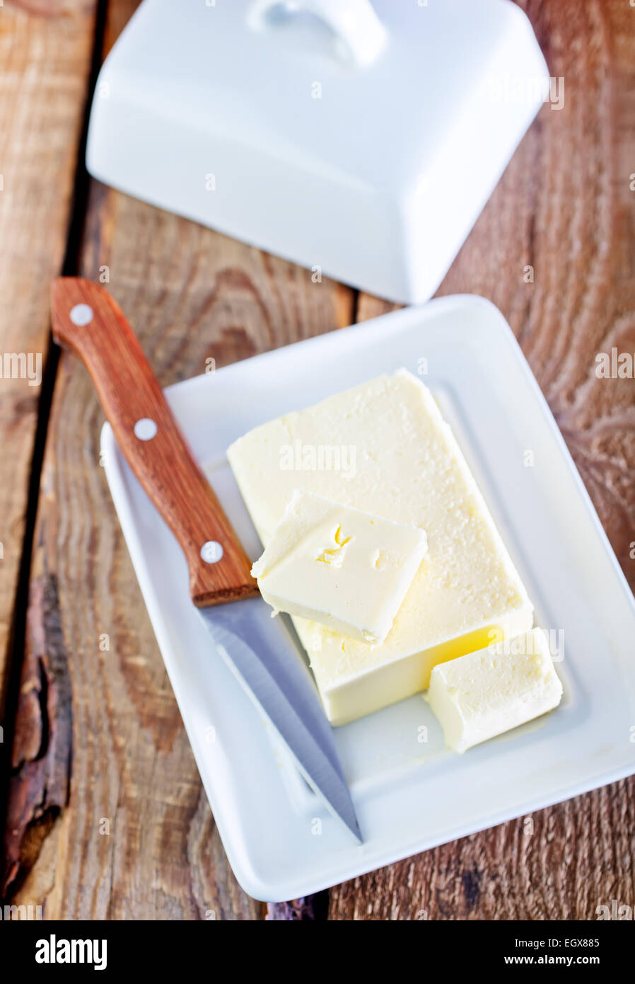 butter and knife on the wooden table Stock Photo - Alamy