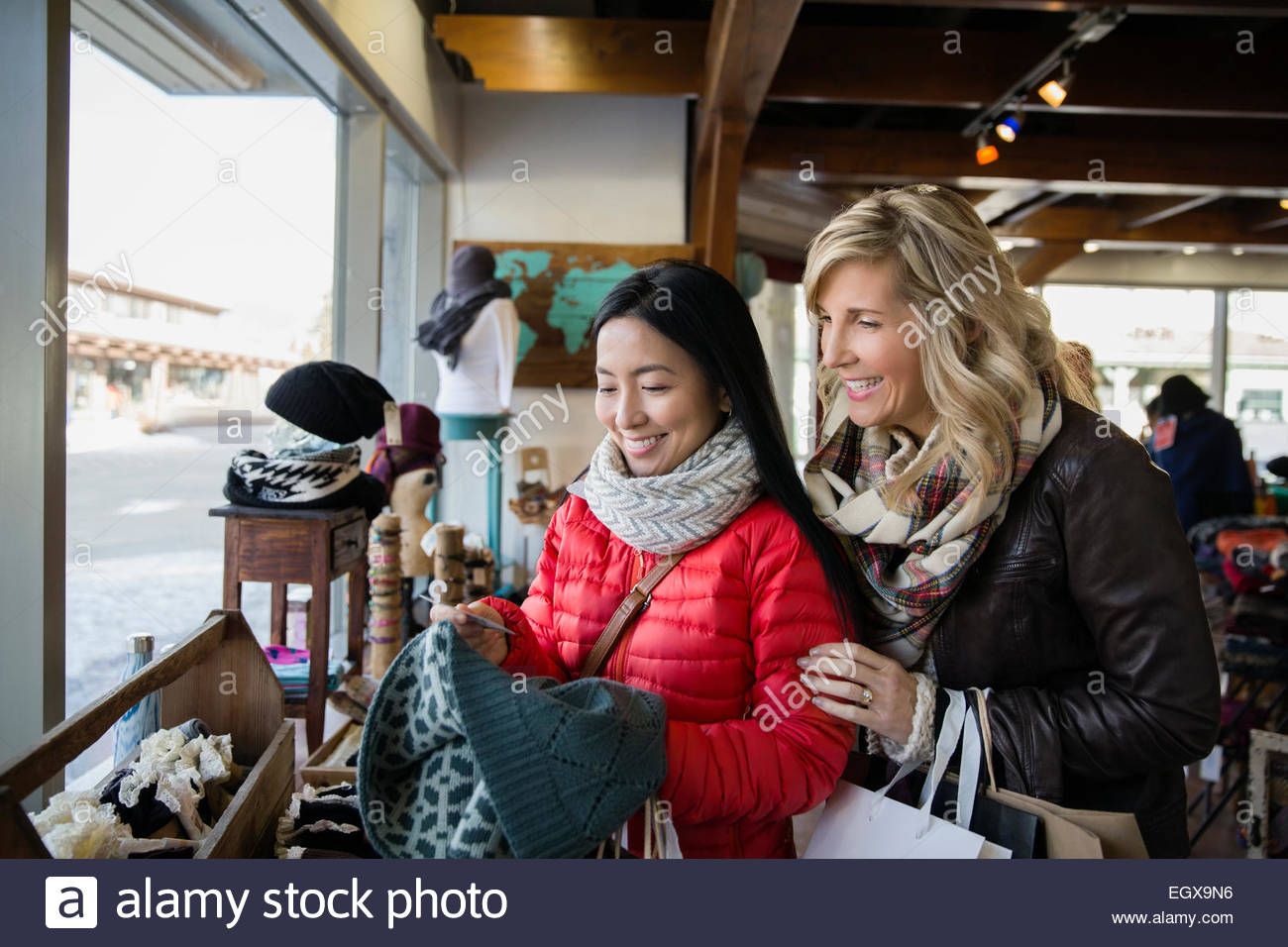 Smiling women browsing in store Stock Photo - Alamy