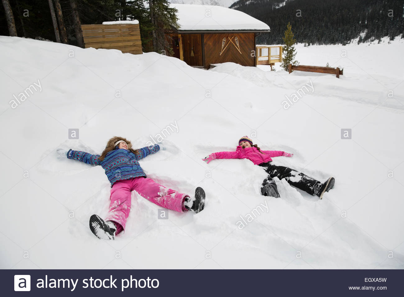 Girl making snow angels hi-res stock photography and images - Alamy