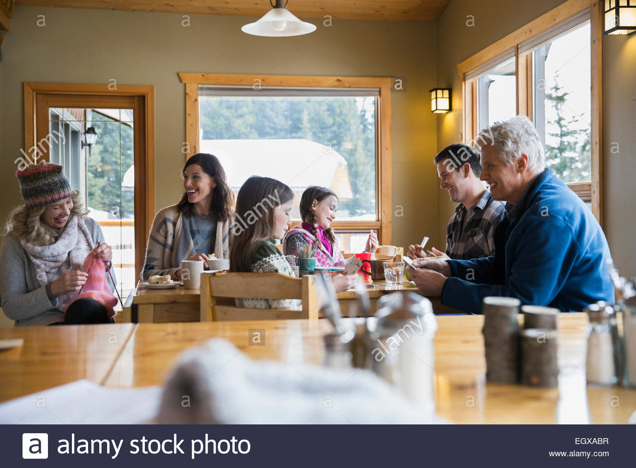 Sitting around the table hi-res stock photography and images - Alamy