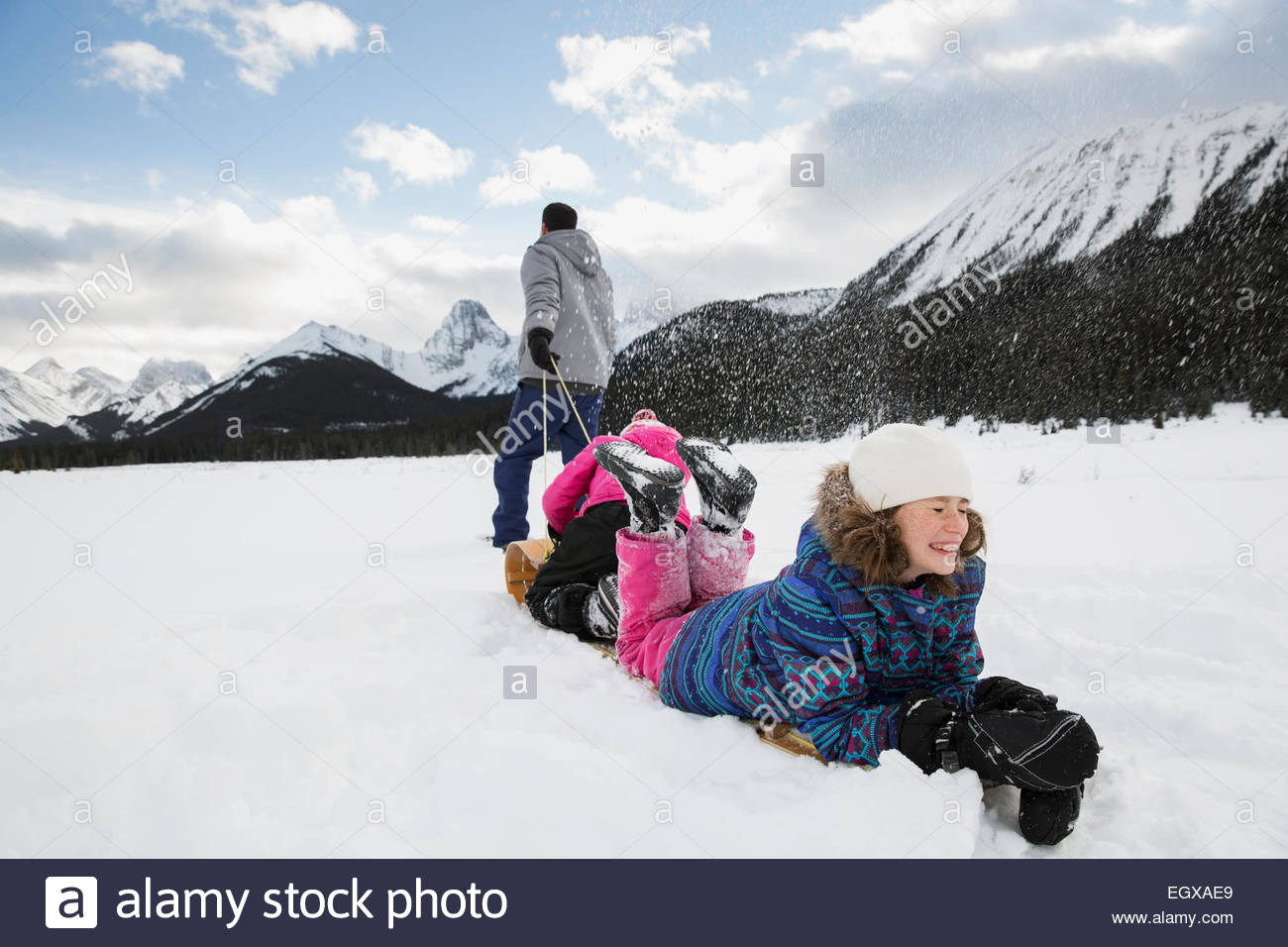 Sledding family hi-res stock photography and images - Alamy