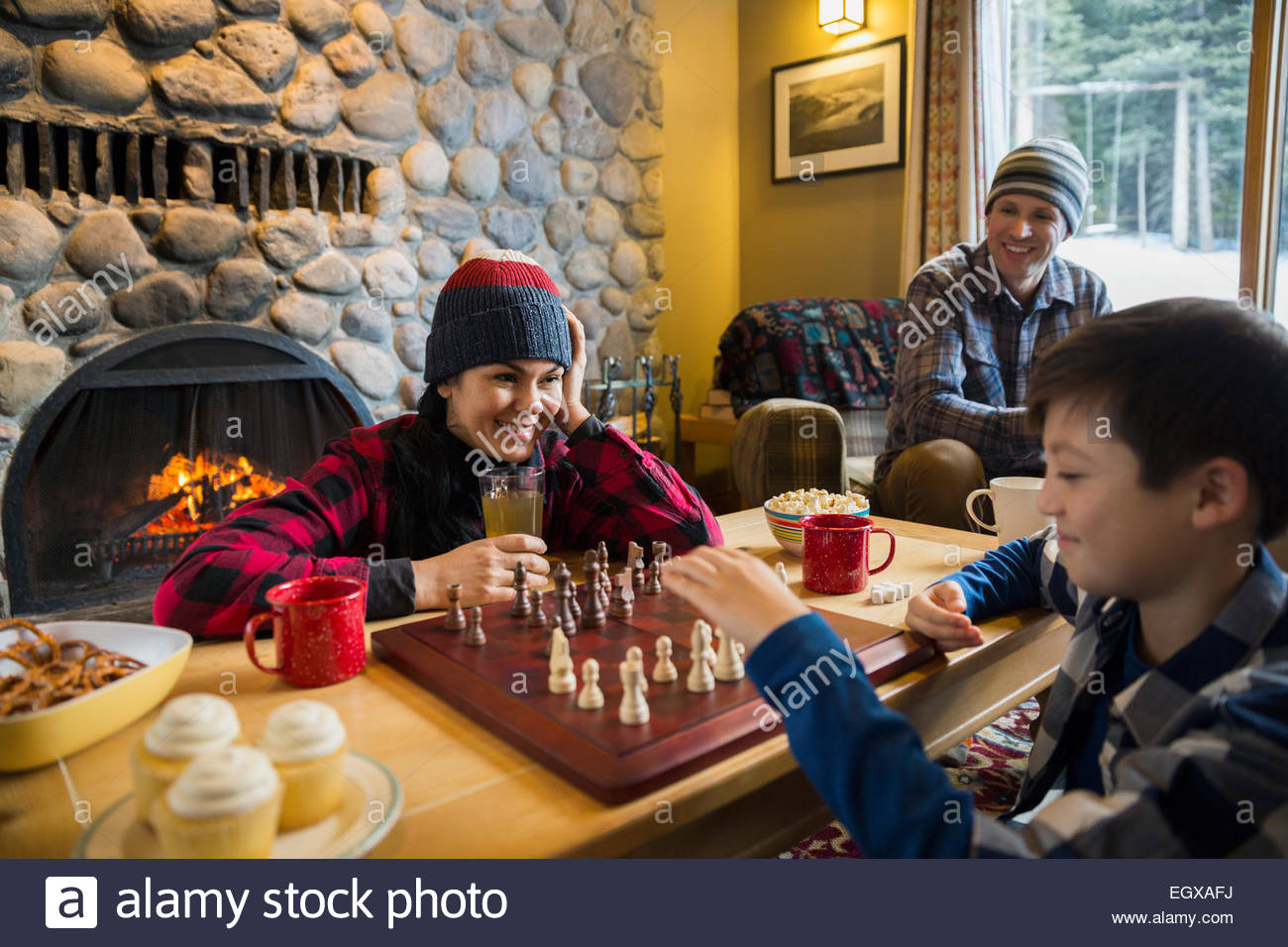 Three playing chess hi-res stock photography and images - Alamy