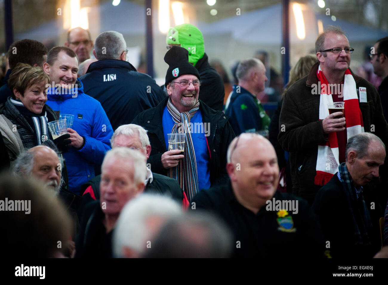 Welsh rugby supporters in scarves and shirts drinking in a bar before ...
