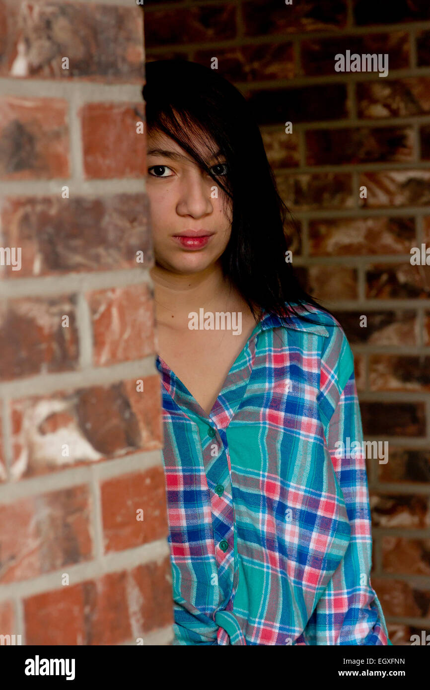 Peering out from wall Stock Photo - Alamy