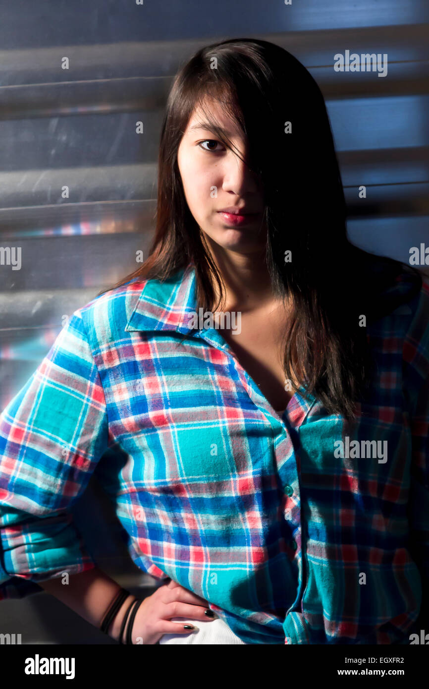 Side lighting on young woman Stock Photo - Alamy