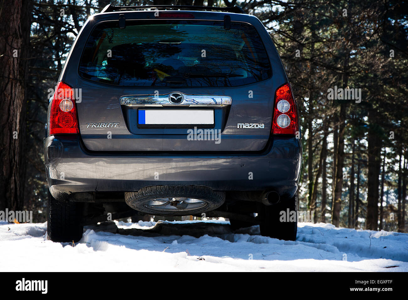 Closeup of back side of Mazda Tribute sport utiliy vehicle in mountain ...