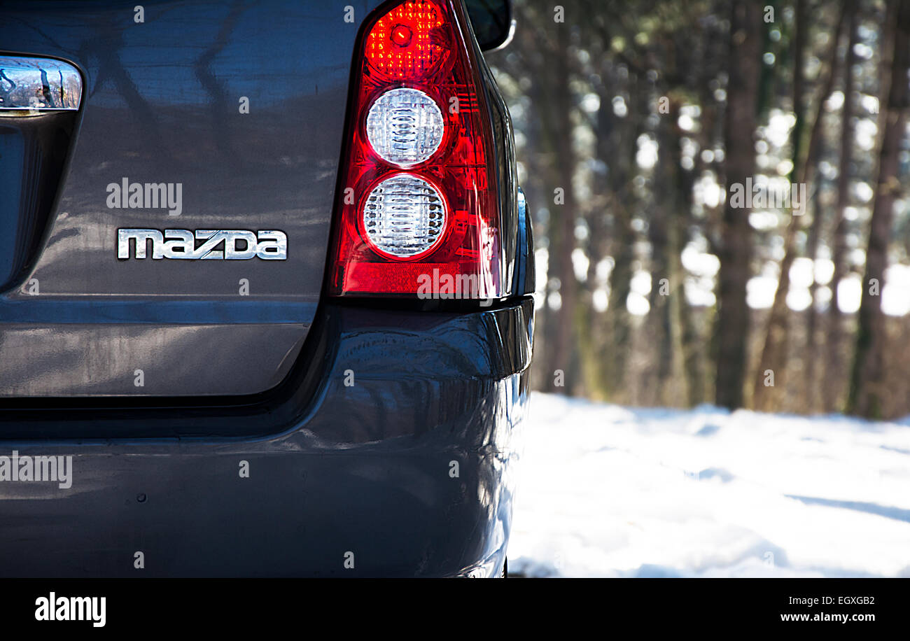 Closeup of back side of Mazda Tribute sport utiliy vehicle in mountain ...