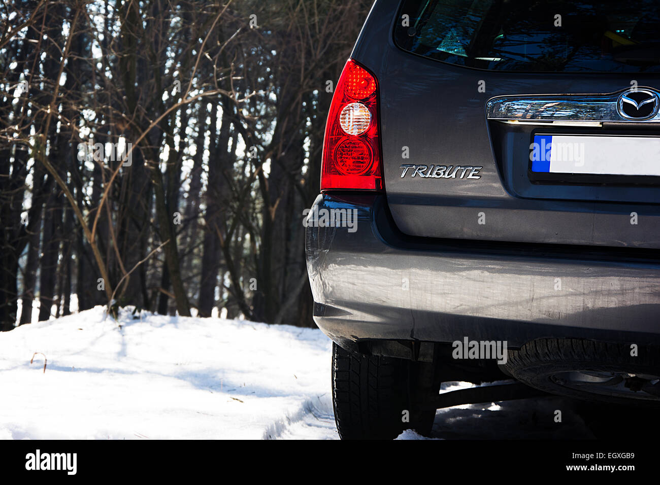 Closeup of back side of Mazda Tribute sport utiliy vehicle in mountain ...