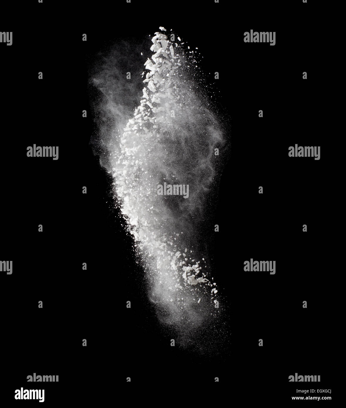Freeze motion of white dust explosion isolated on black Stock Photo - Alamy