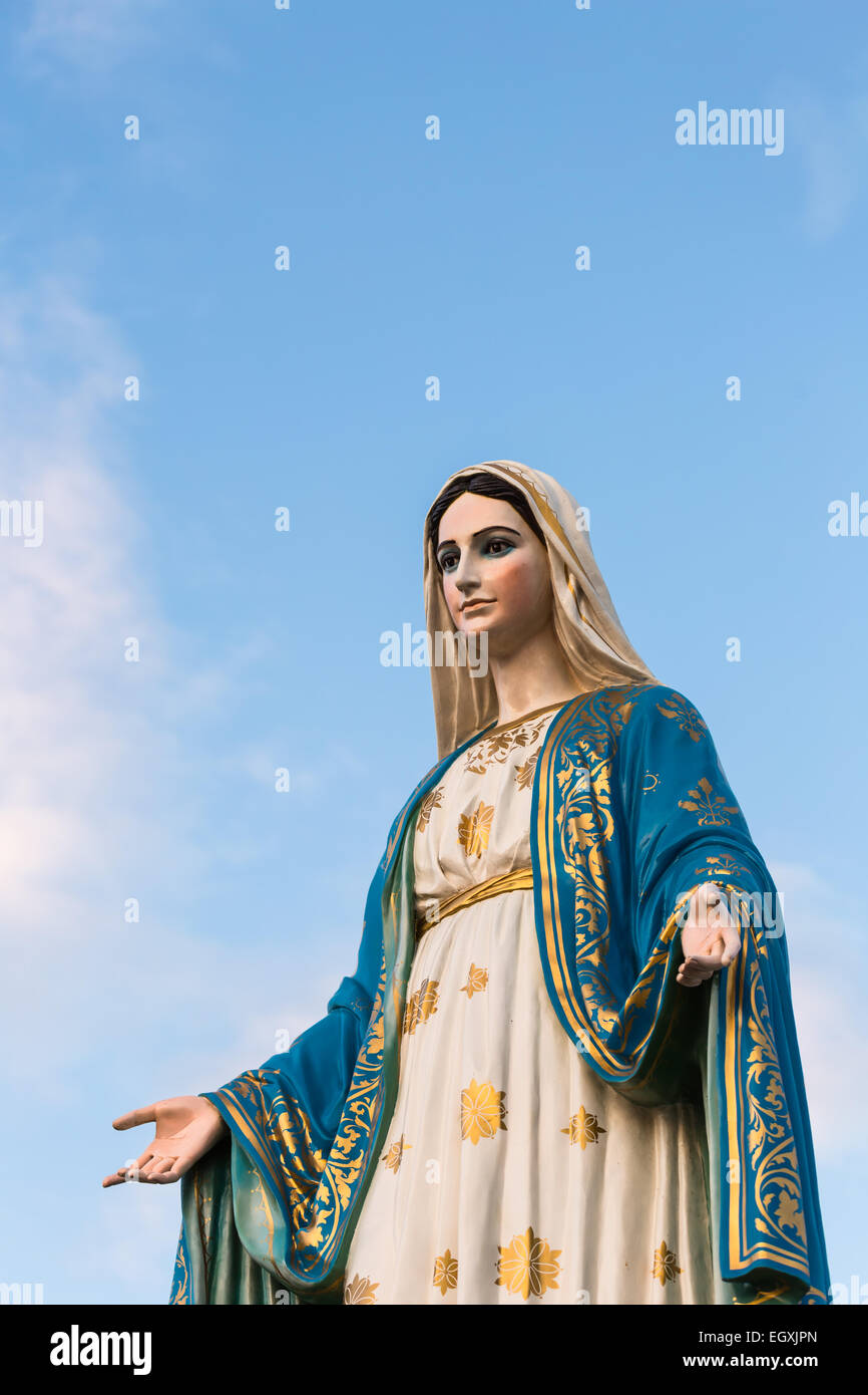 Saint Mary or the Blessed Virgin Mary, the mother of Jesus, in front of ...