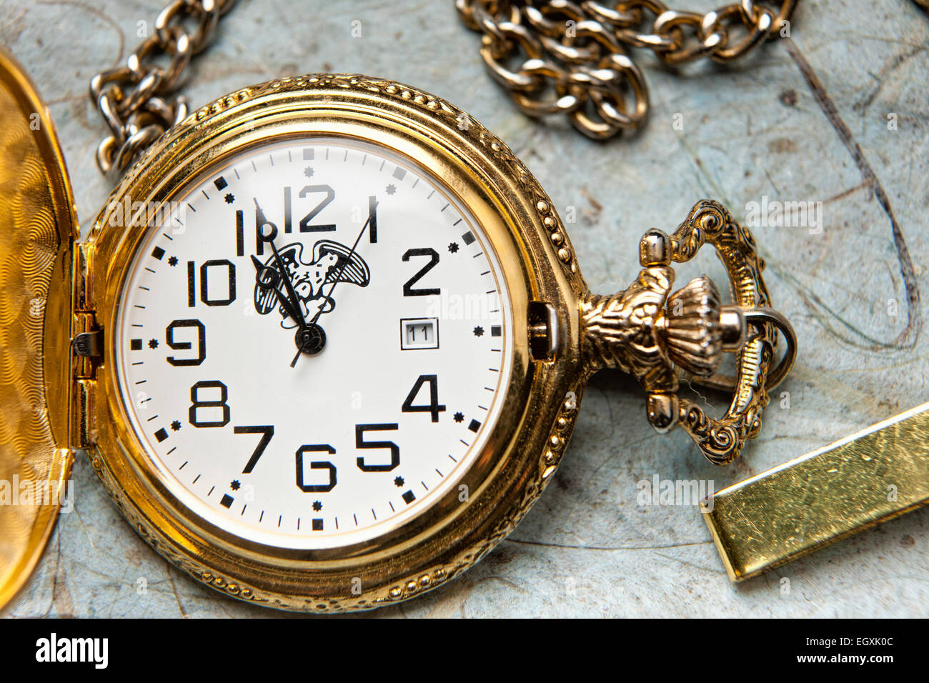 A close up image of a pocket watch and chain Stock Photo - Alamy