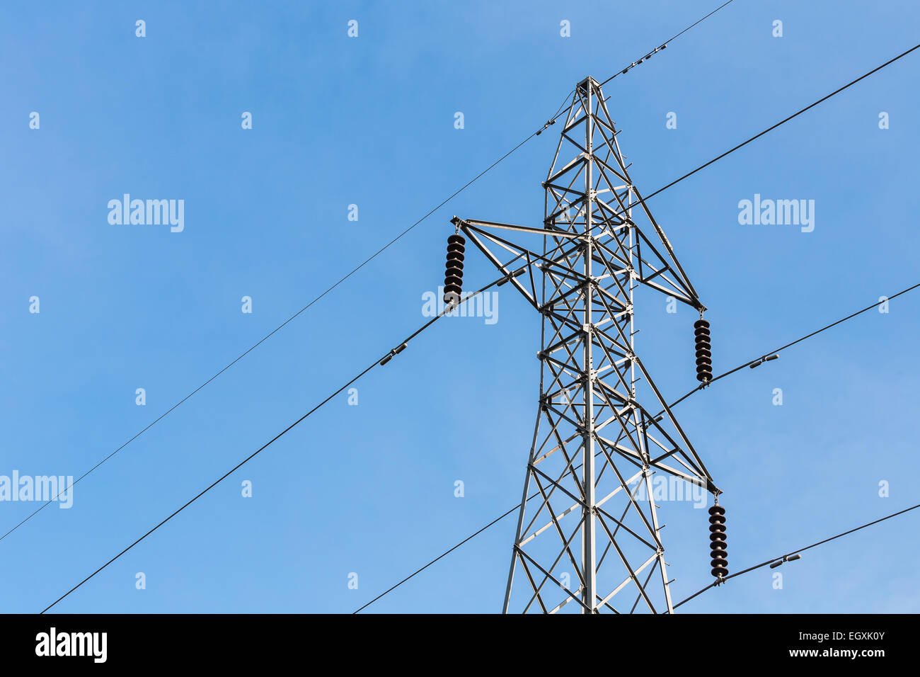 The transmission tower on blue sky background Stock Photo - Alamy