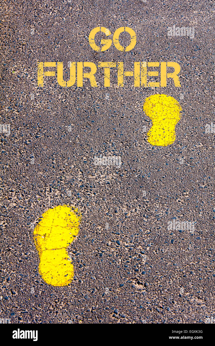 Yellow footsteps on sidewalk towards Go Further message.Conceptual ...