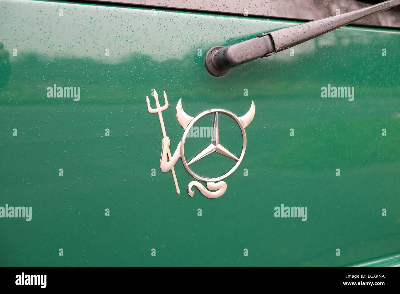 Mercedes Benz car badge as as Devil Stock Photo - Alamy