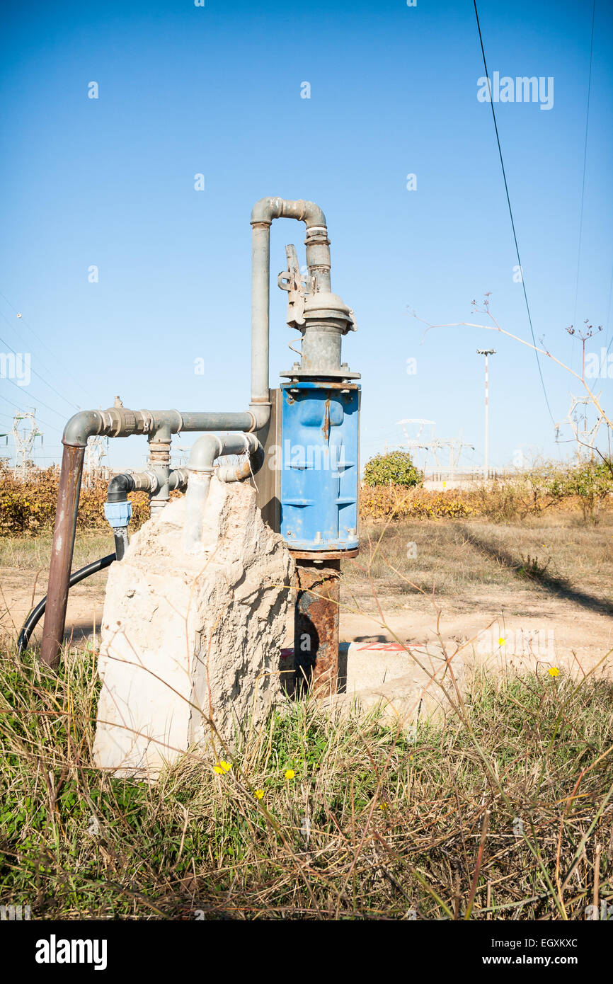 pipe connections in the countryside. Blue Cap Stock Photo - Alamy