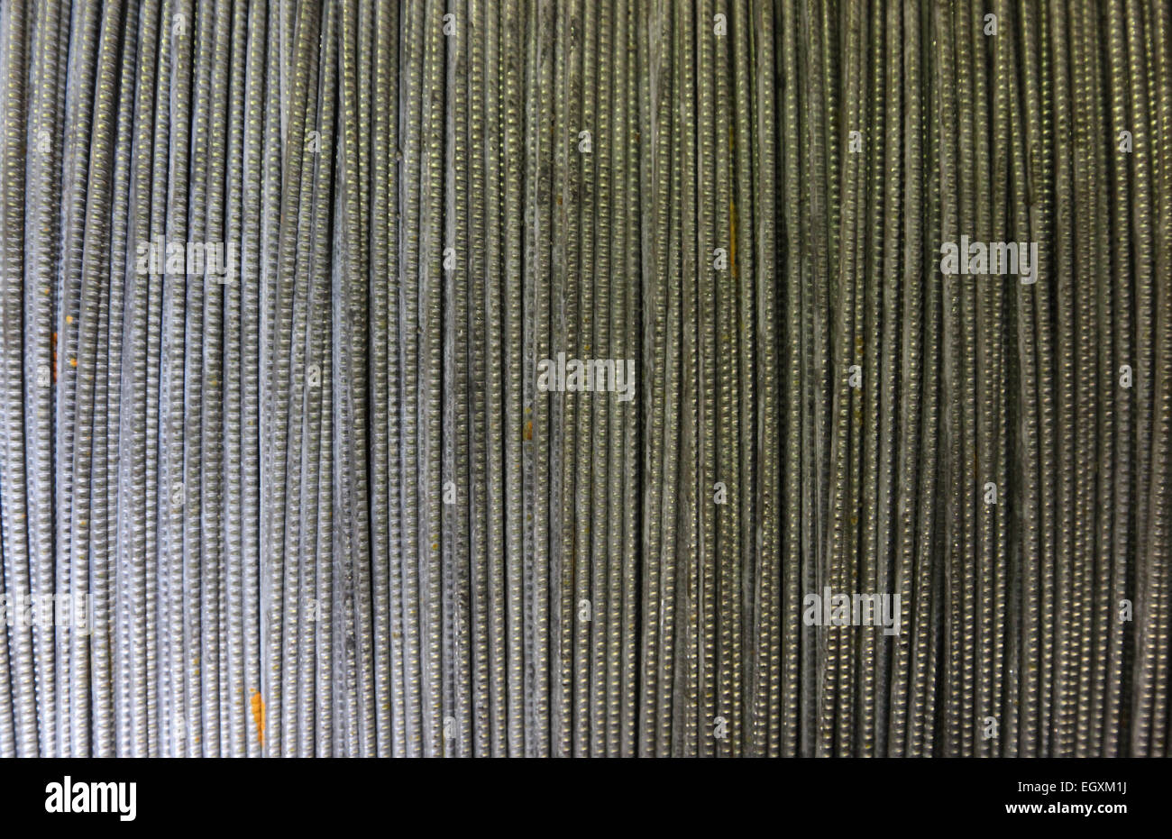 Texture formed by a thin metal fittings packed into riots in stock ...