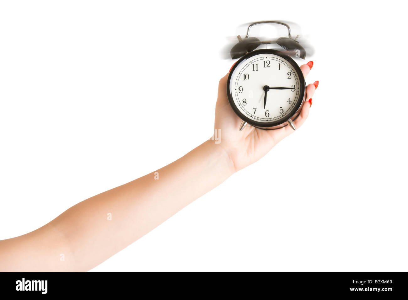 Female hand holding an alarm clock ringing isolated in white Stock ...