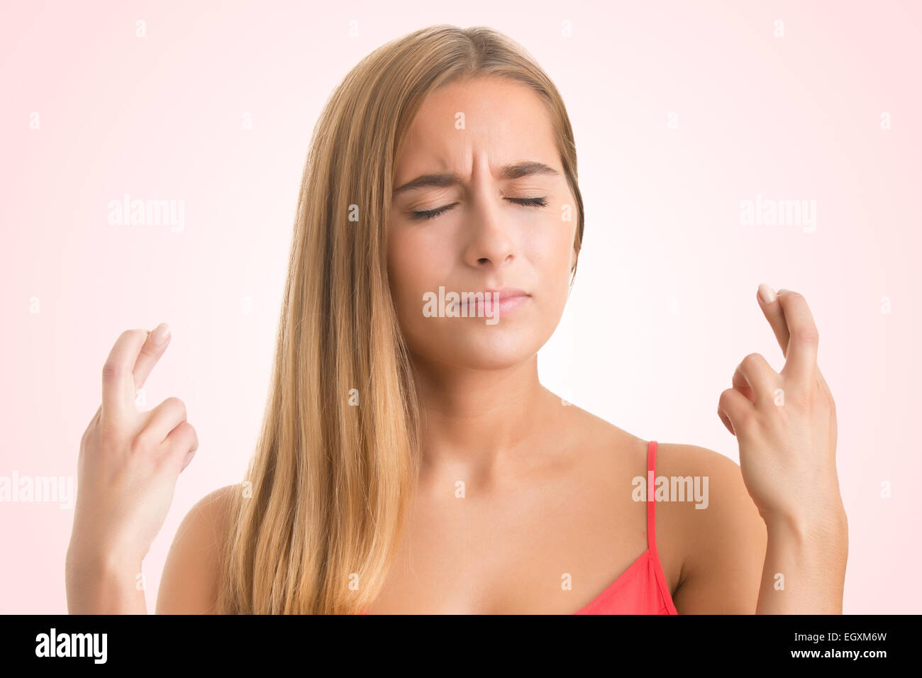 Fingers crossed woman hi-res stock photography and images - Alamy