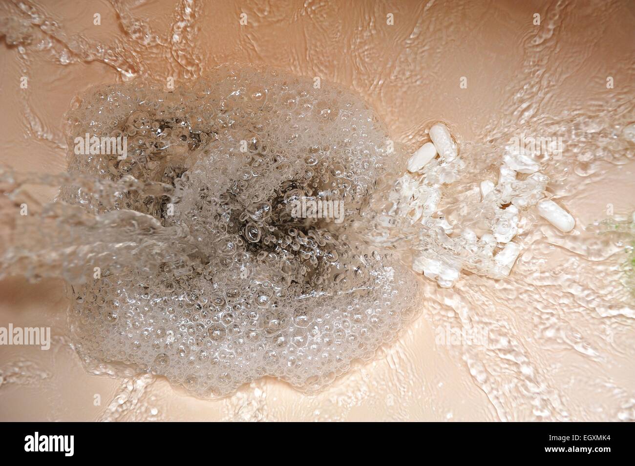 Prescription Tablets flushing down a domestic toilet bowl Stock Photo ...