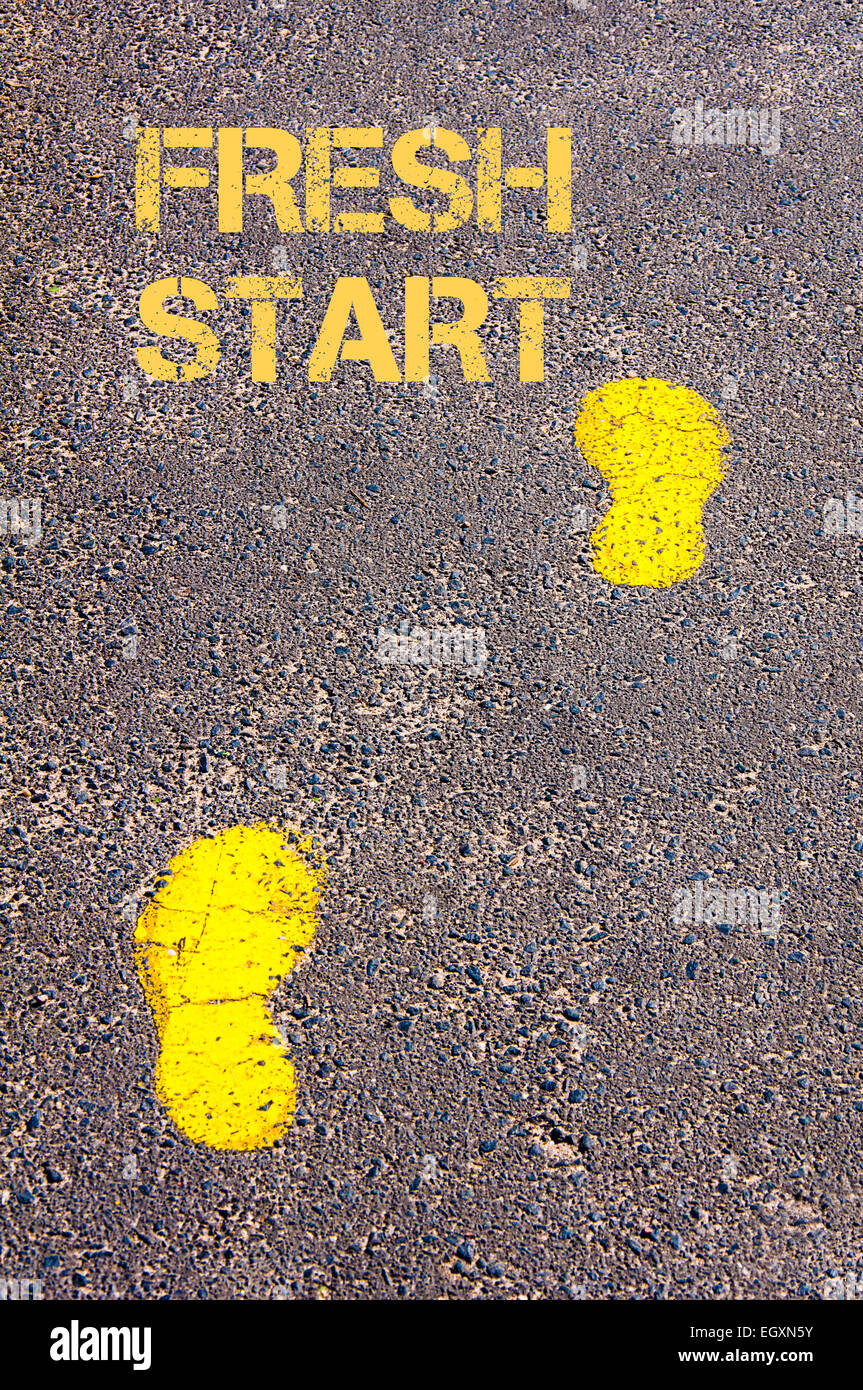 Yellow footsteps on sidewalk towards Fresh Start message.Conceptual ...