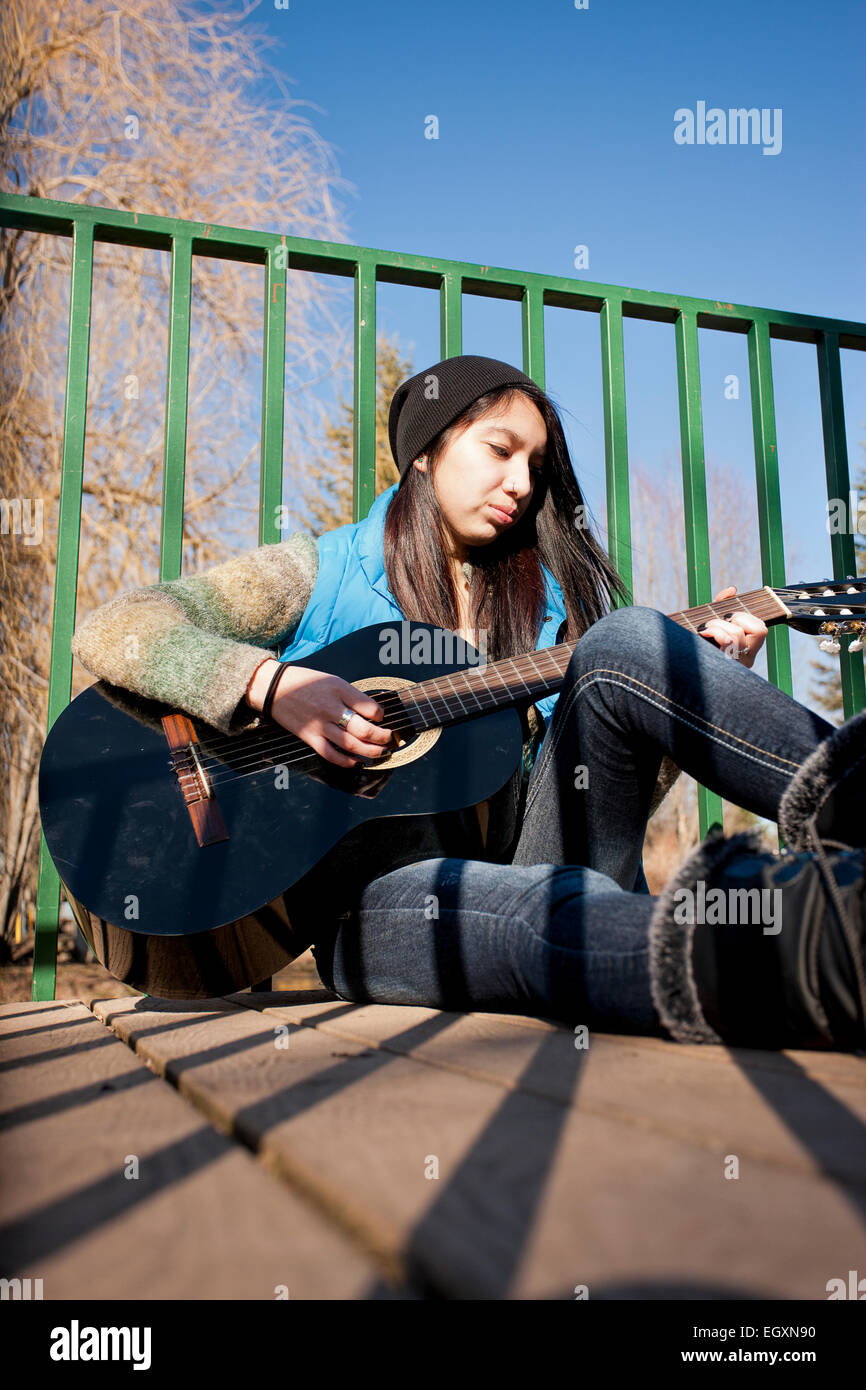 Strumming the guitar outdoors Stock Photo - Alamy