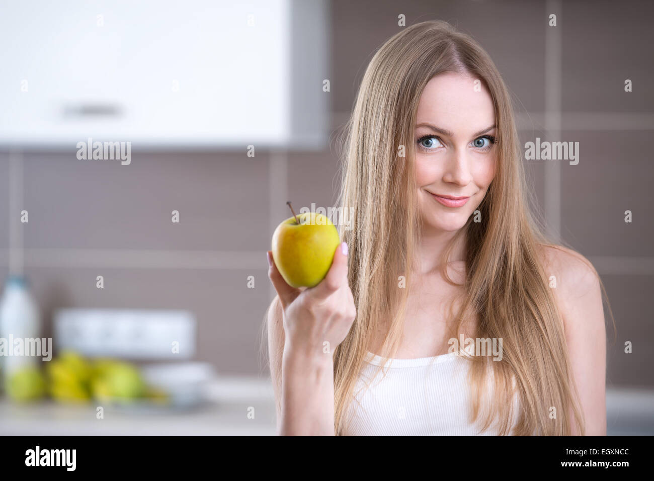 Woman with apple Stock Photo - Alamy