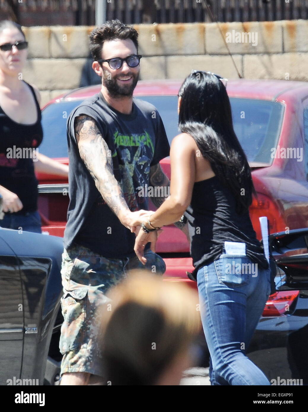 Newlyweds Adam Levine and Behati Prinsloo arrive on the set of Maroon 5 ...