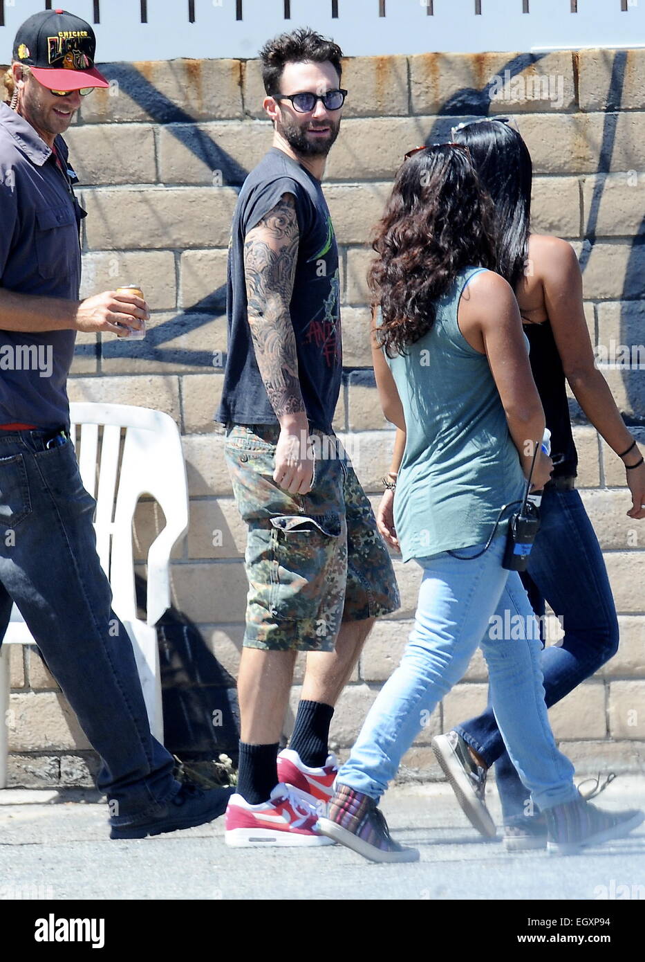 Newlyweds Adam Levine and Behati Prinsloo arrive on the set of Maroon 5 ...
