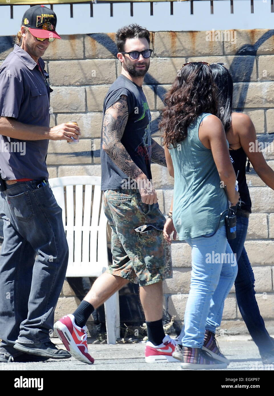 Newlyweds Adam Levine and Behati Prinsloo arrive on the set of Maroon 5 ...