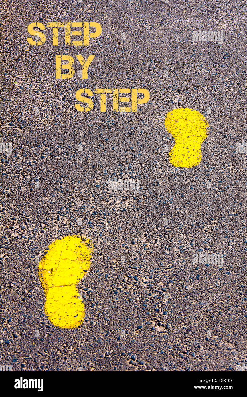 Yellow footsteps on sidewalk towards Step by Step message.Concept image ...