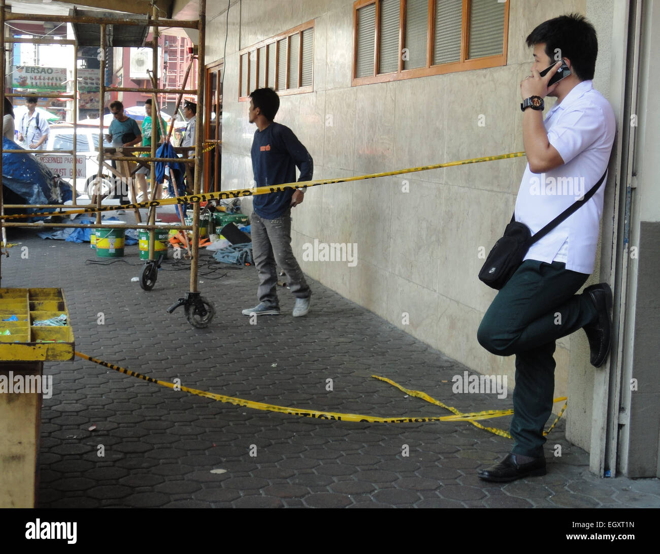 A student from the Far Eastern University (FEU) talks with his cellular ...