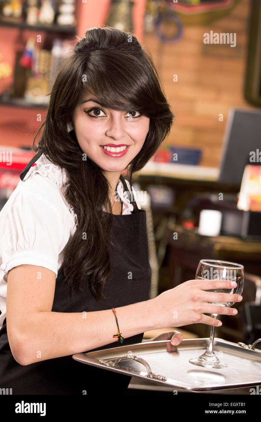 beautiful young waitress girl serving a drink Stock Photo - Alamy