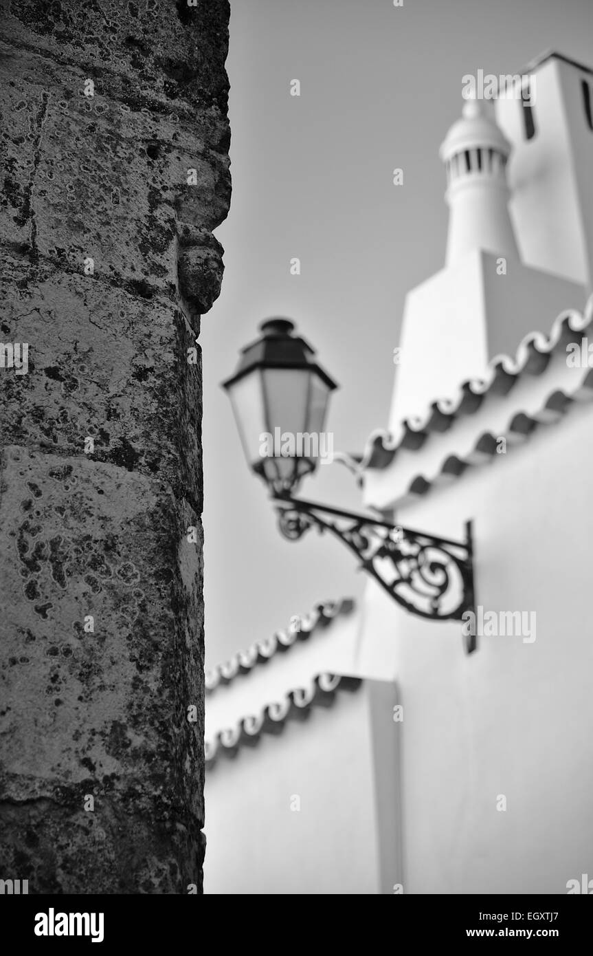 Detail of a small head sculpted in a stone column Stock Photo - Alamy
