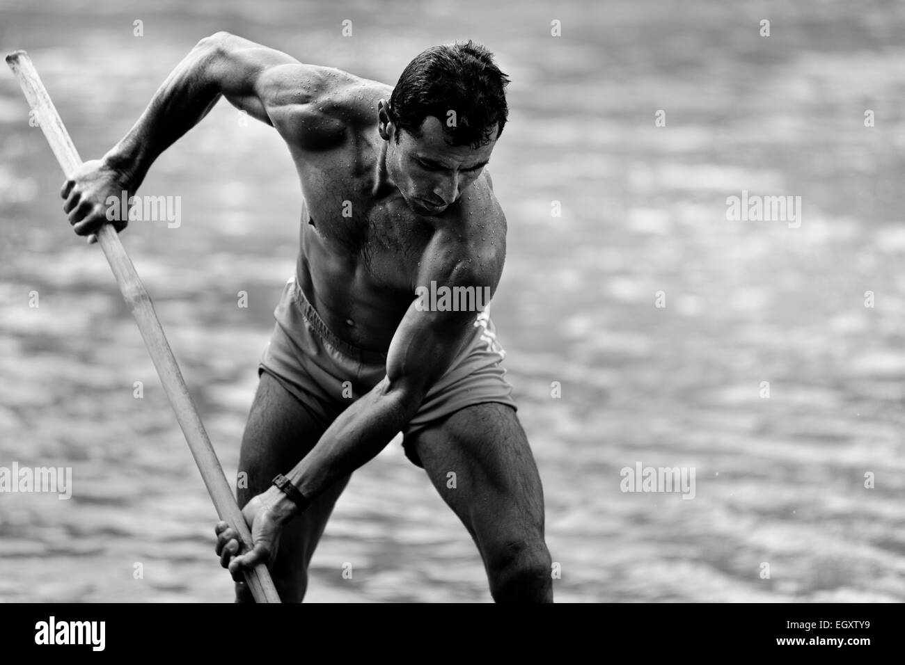A Colombian sand miner unloads the extracted sand from his boat on the ...
