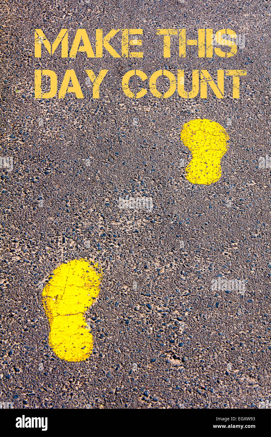 Yellow footsteps on sidewalk towards Make This Day Count message ...