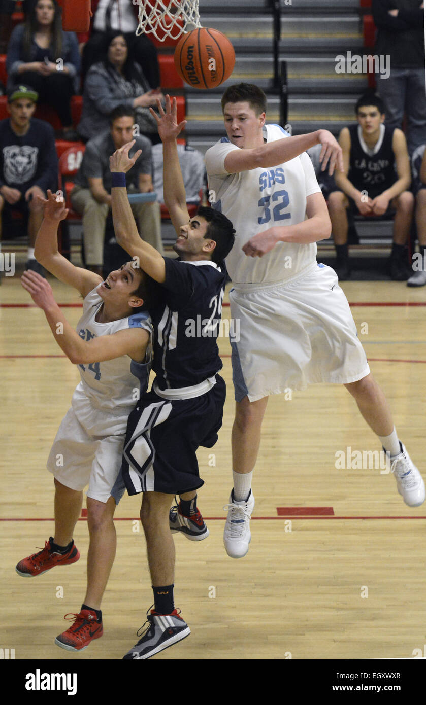 Usa. 3rd Mar, 2015. SPORTS -- The ball gets away from Sandia's Ander ...