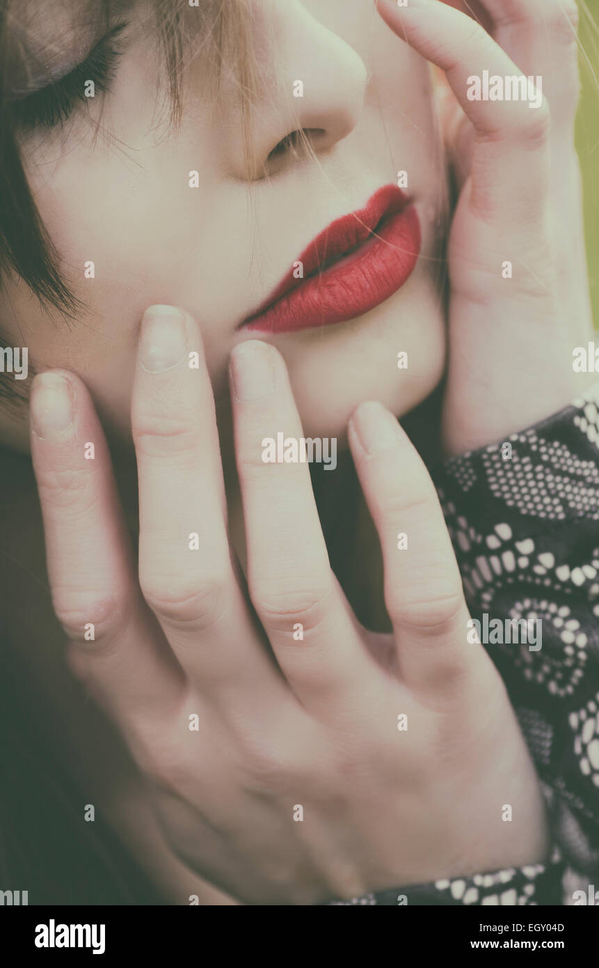 Beautiful young woman hands touching face Stock Photo - Alamy