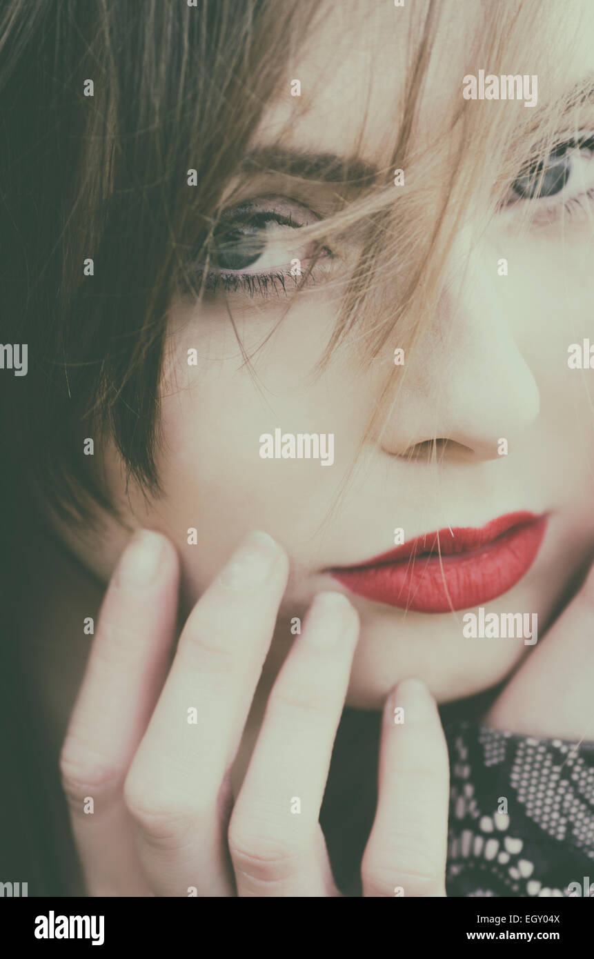 Serious young woman staring Stock Photo - Alamy