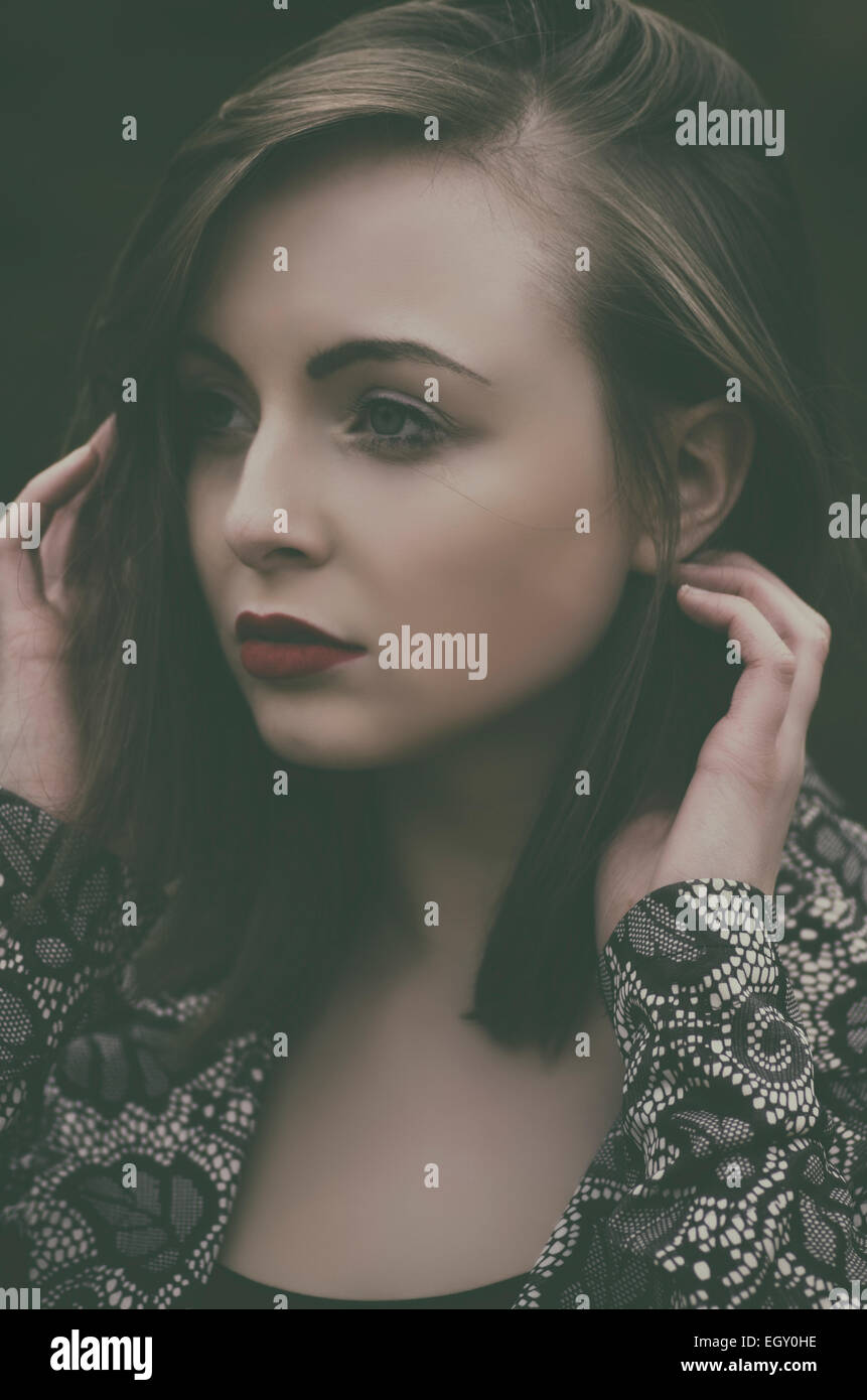 Beautiful young woman looking away Stock Photo - Alamy
