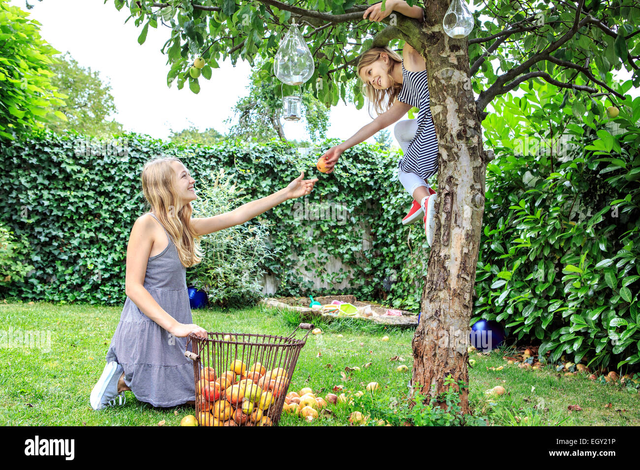 Two girls in garden hi-res stock photography and images - Alamy