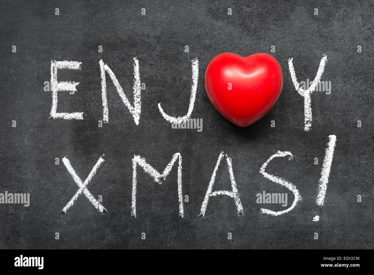 enjoy Xmas exclamation handwritten on chalkboard with heart symbol ...