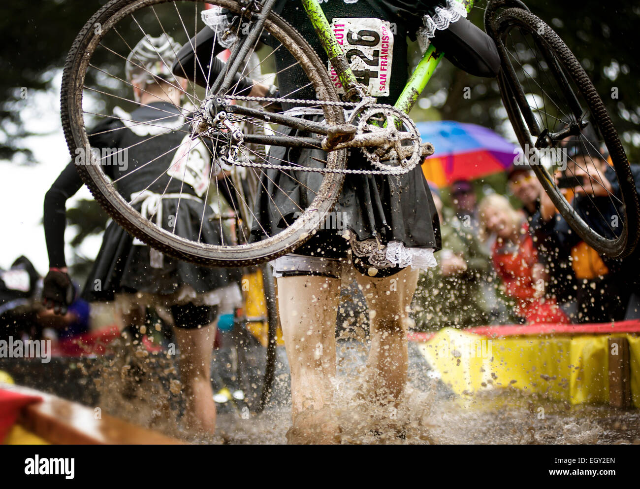 Cyclocross racer steps through water obstacle in SF Stock Photo - Alamy