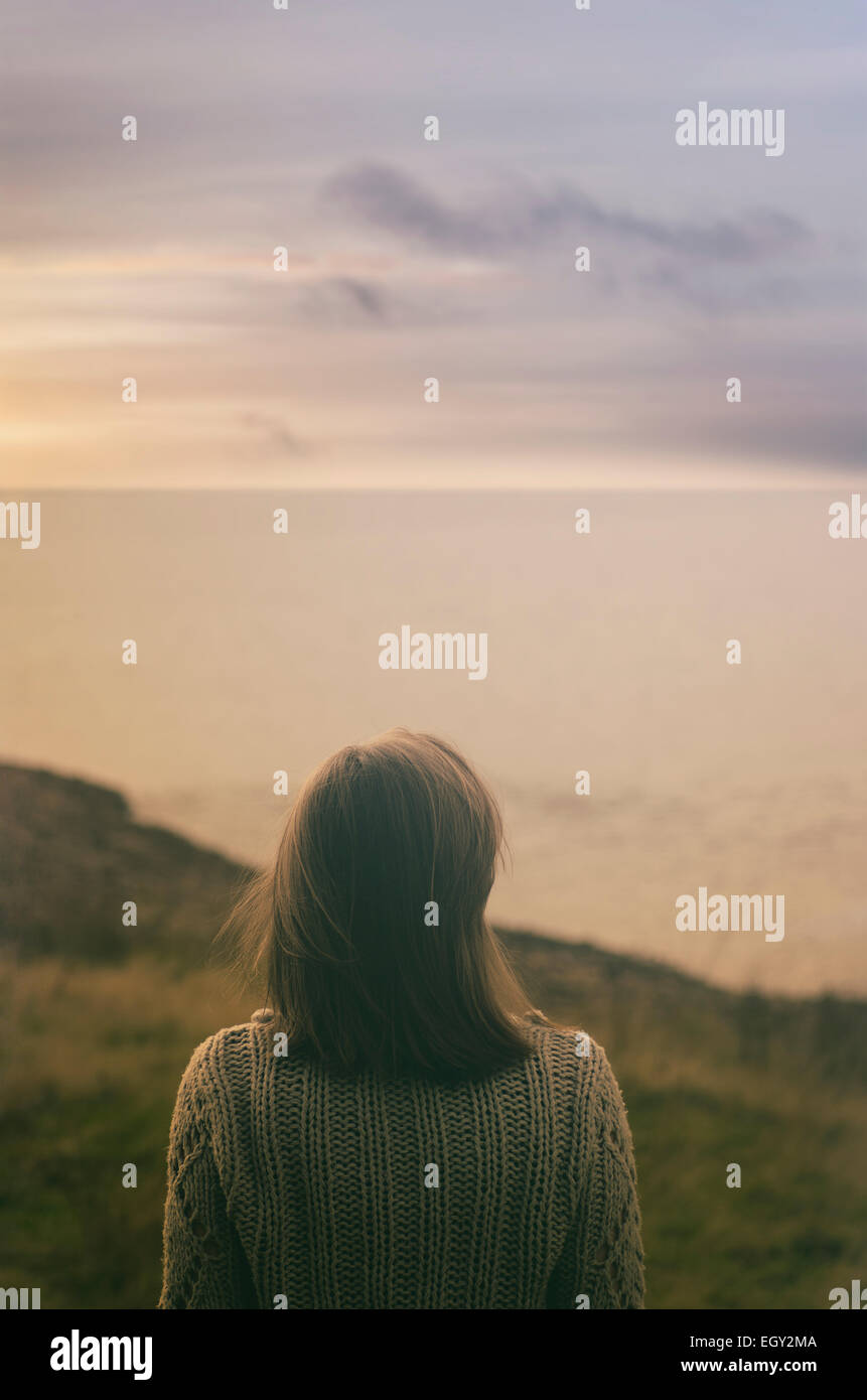 Young woman standing in the countryside Stock Photo - Alamy