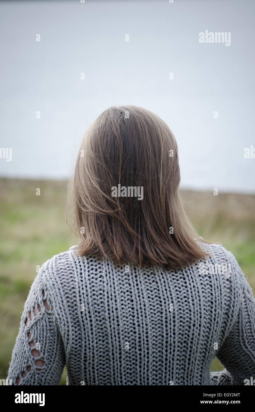 Young woman standing in the countryside Stock Photo - Alamy